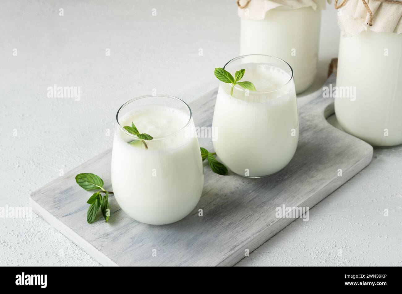 Glass cup of Turkish traditional drink ayran , kefir or buttermilk made ...