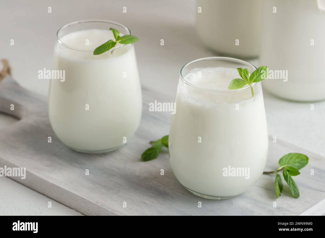 Glass cup of Turkish traditional drink ayran , kefir or buttermilk made ...