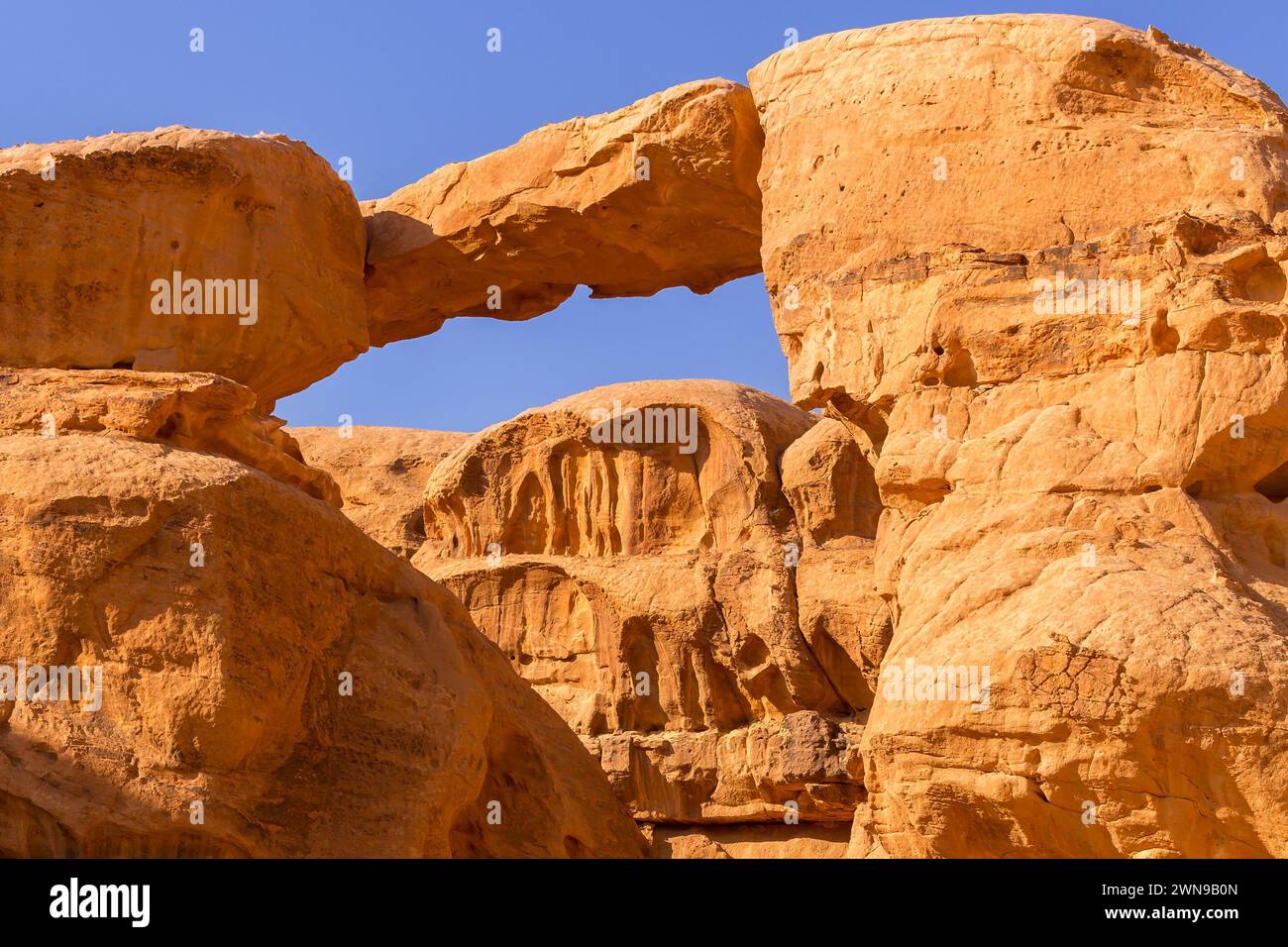 View through a rock arch in desert of Wadi Rum, Jordan, Middle East ...