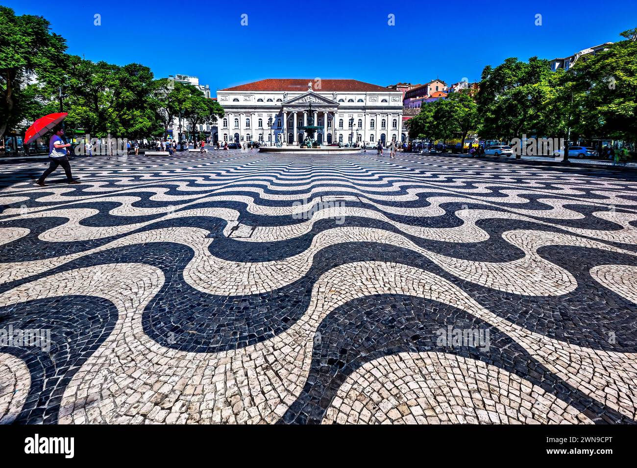 Wavy black and white patterned pavement in a sunny urban square with ...