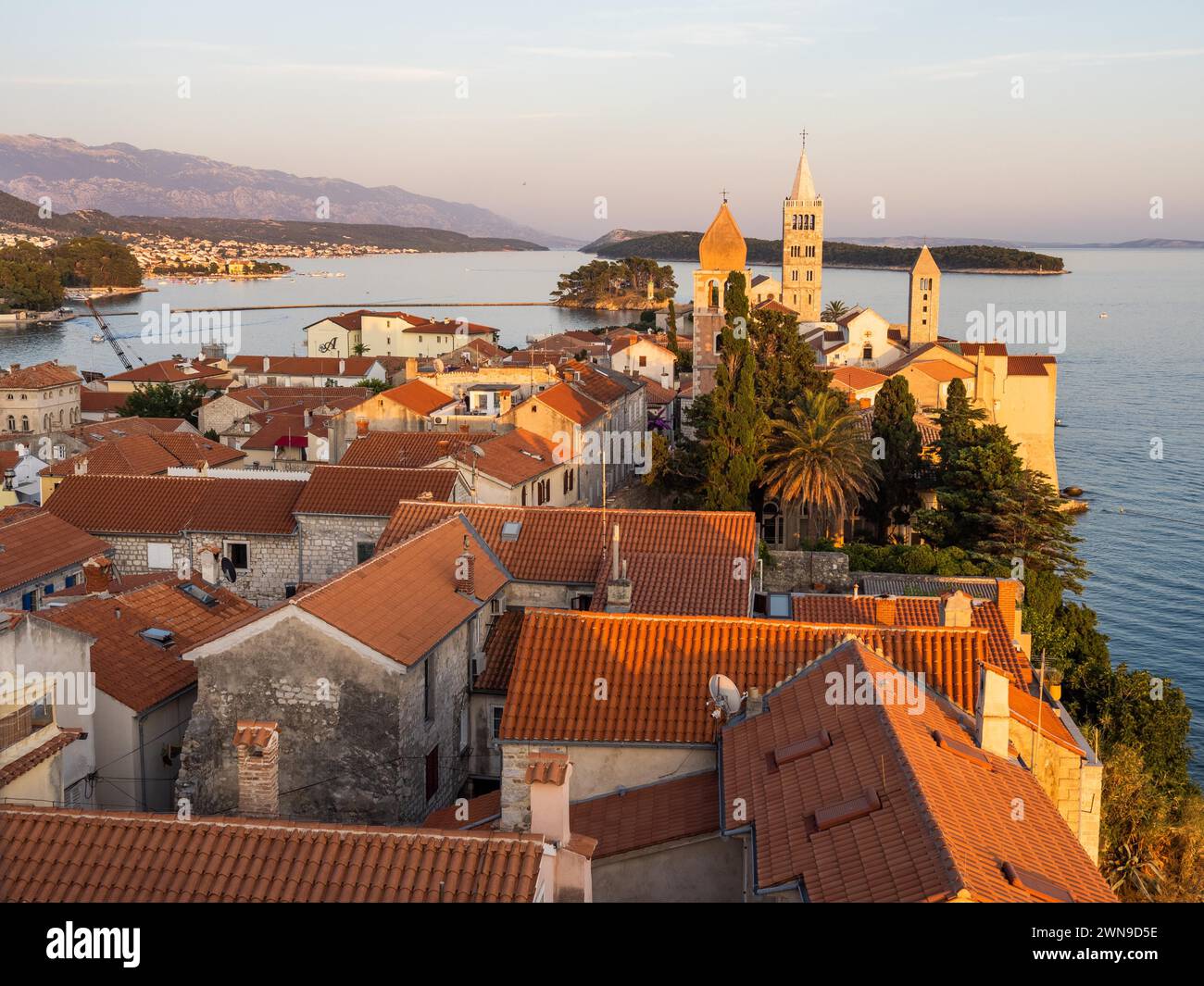 Old town of Rab and church towers in the evening light, Churches of Rab ...