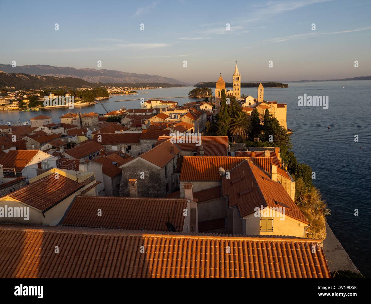 Old town of Rab and church towers in the evening light, Churches of Rab ...