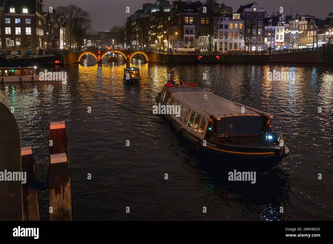 Lights on the Herengracht canal and Amstel River, Amsterdam ...