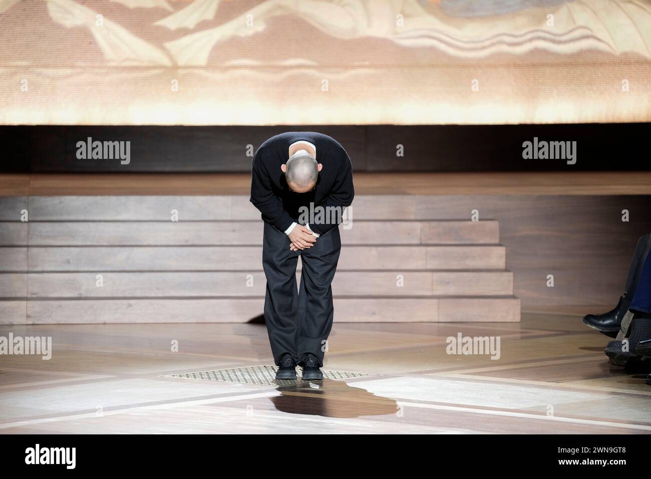 Designer Satoshi Kondo accepts applause after the Issey Miyake Fall ...