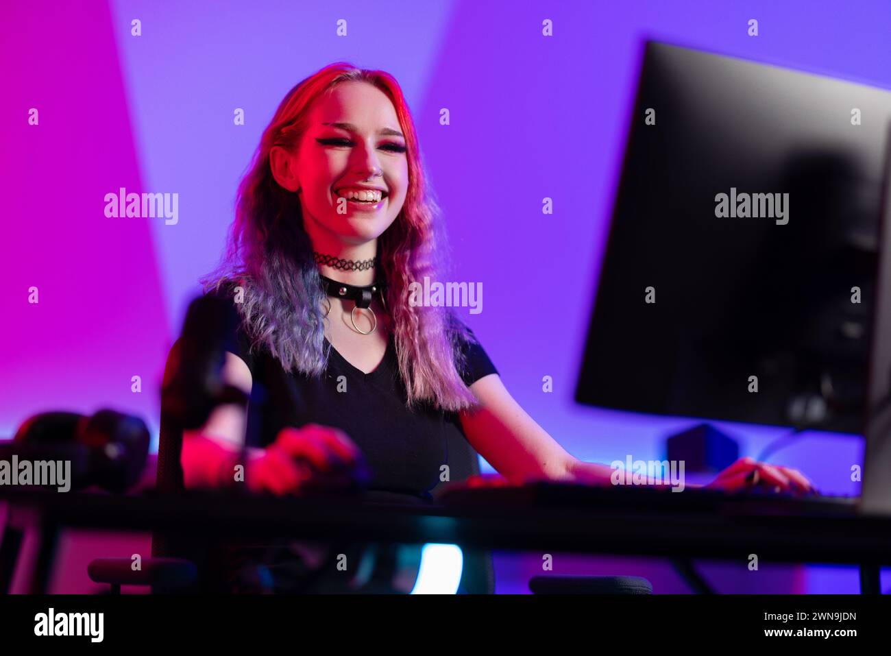 Focused and Happy Professional Gamer Engaged in an Intense Gaming ...