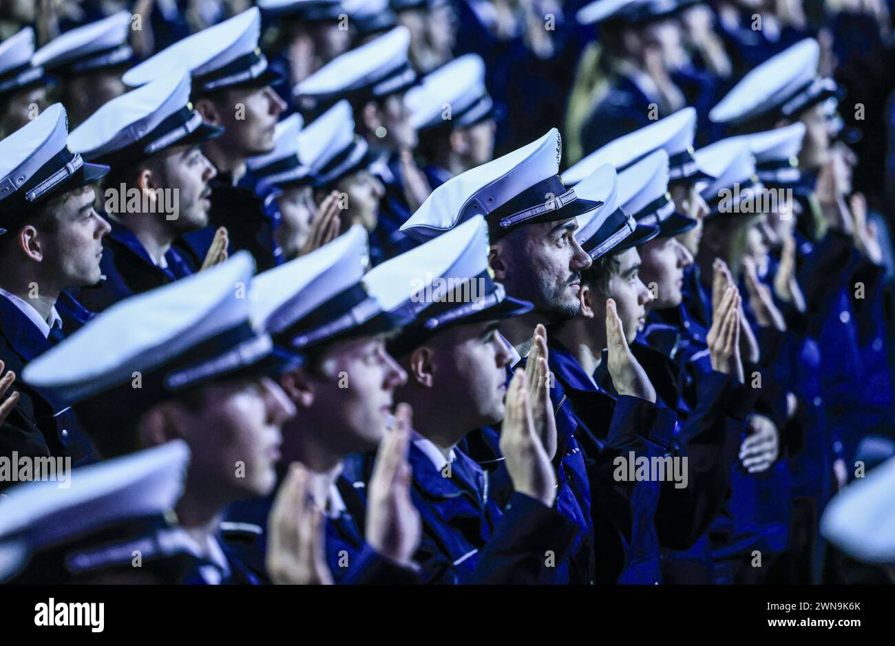 Cologne, Germany. 01st Mar, 2024. Police candidates read the oath of ...