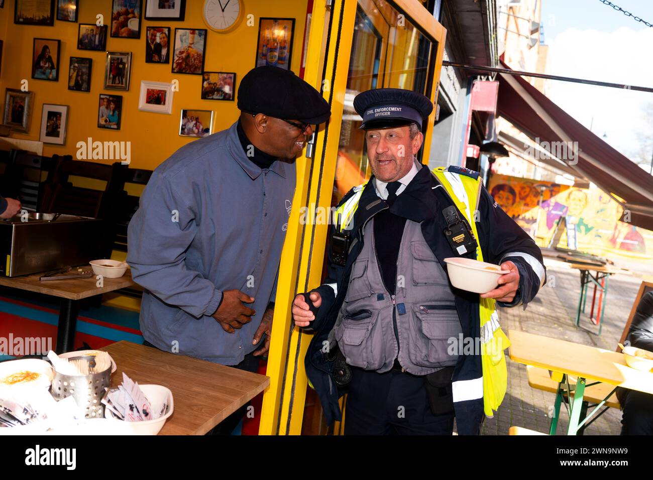Ian Wright poses with a Civil Enforcement Officer as he hands out 100 ...