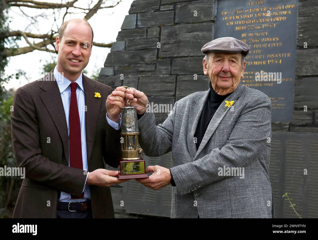 The Prince of Wales holding a lamp with Alan Jones chairman of Gresford ...