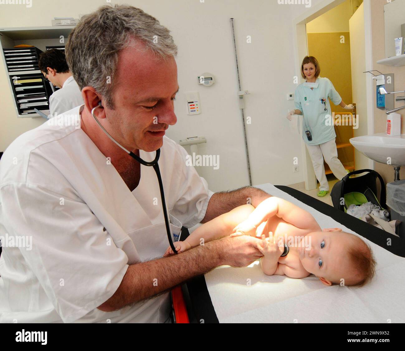 a baby or infant at the examination at the pediatrician a baby at the ...