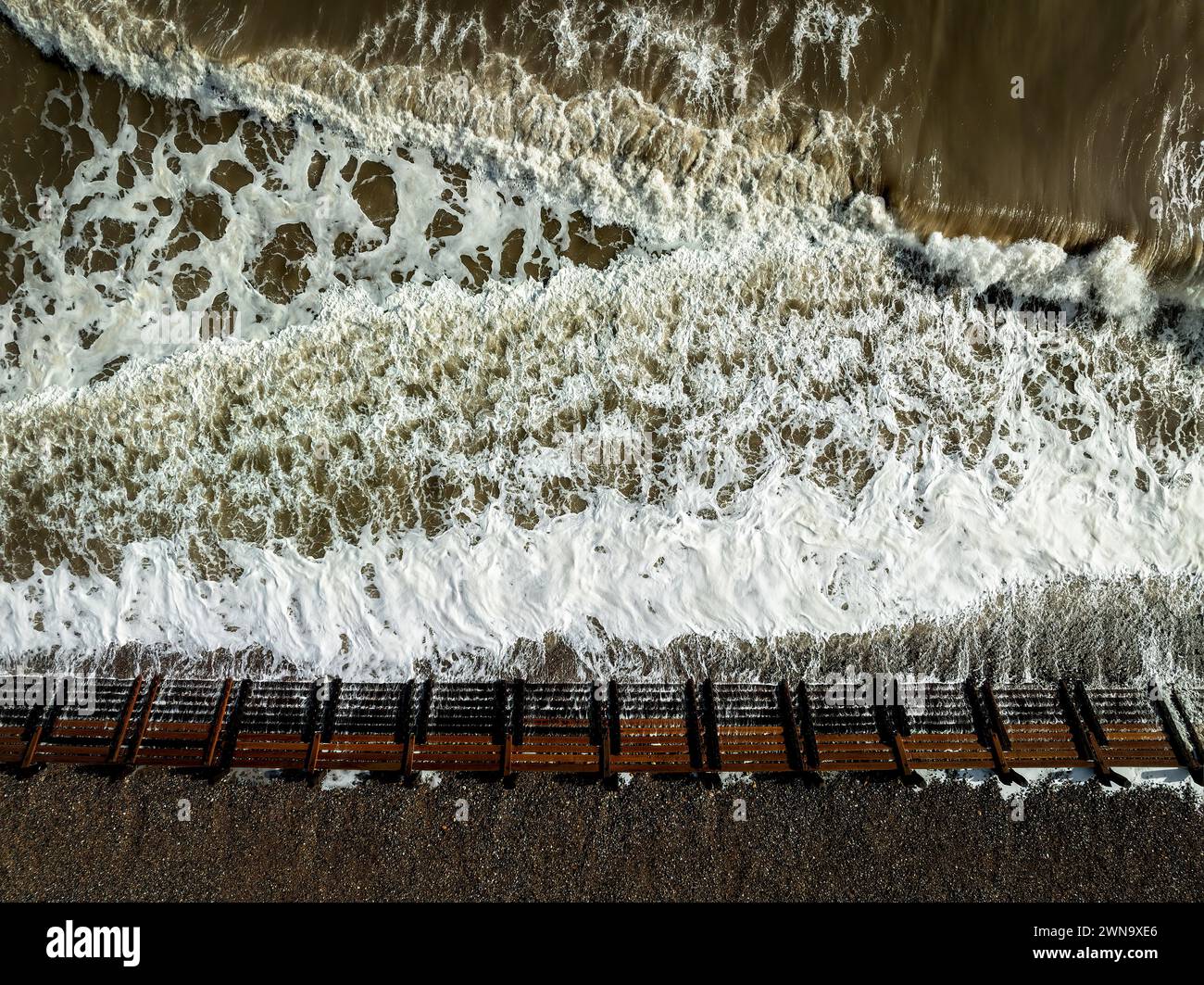 High tide waves crashing onto the revetments at Overstrand, Norfolk, UK ...