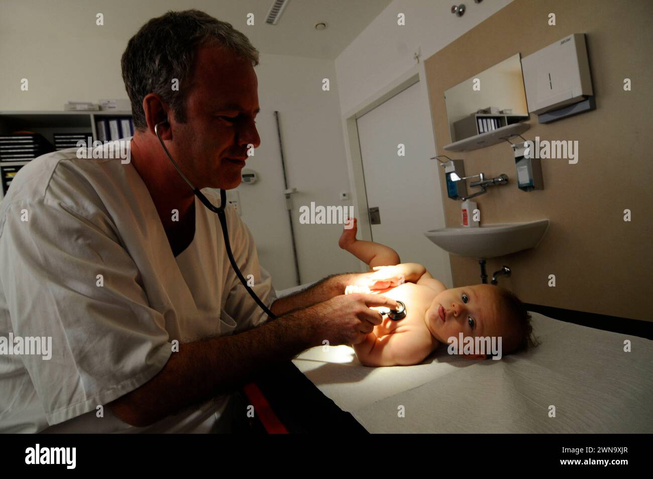 a baby or infant at the examination at the pediatrician a baby at the ...