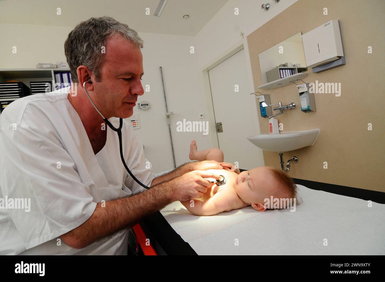 a baby or infant at the examination at the pediatrician a baby at the ...