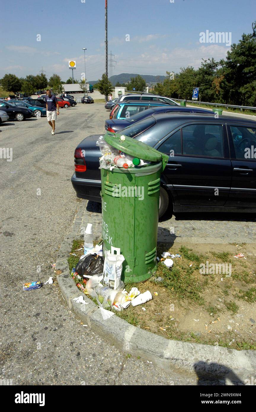garbage and waste on a highway parking lot, environmental protection ...