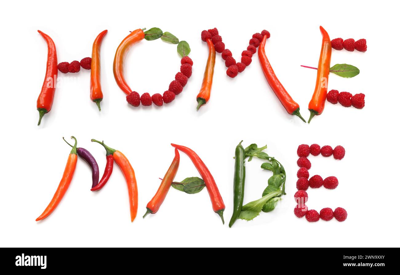word HOME MADE from green yellow purple red chili peppers, berry ...