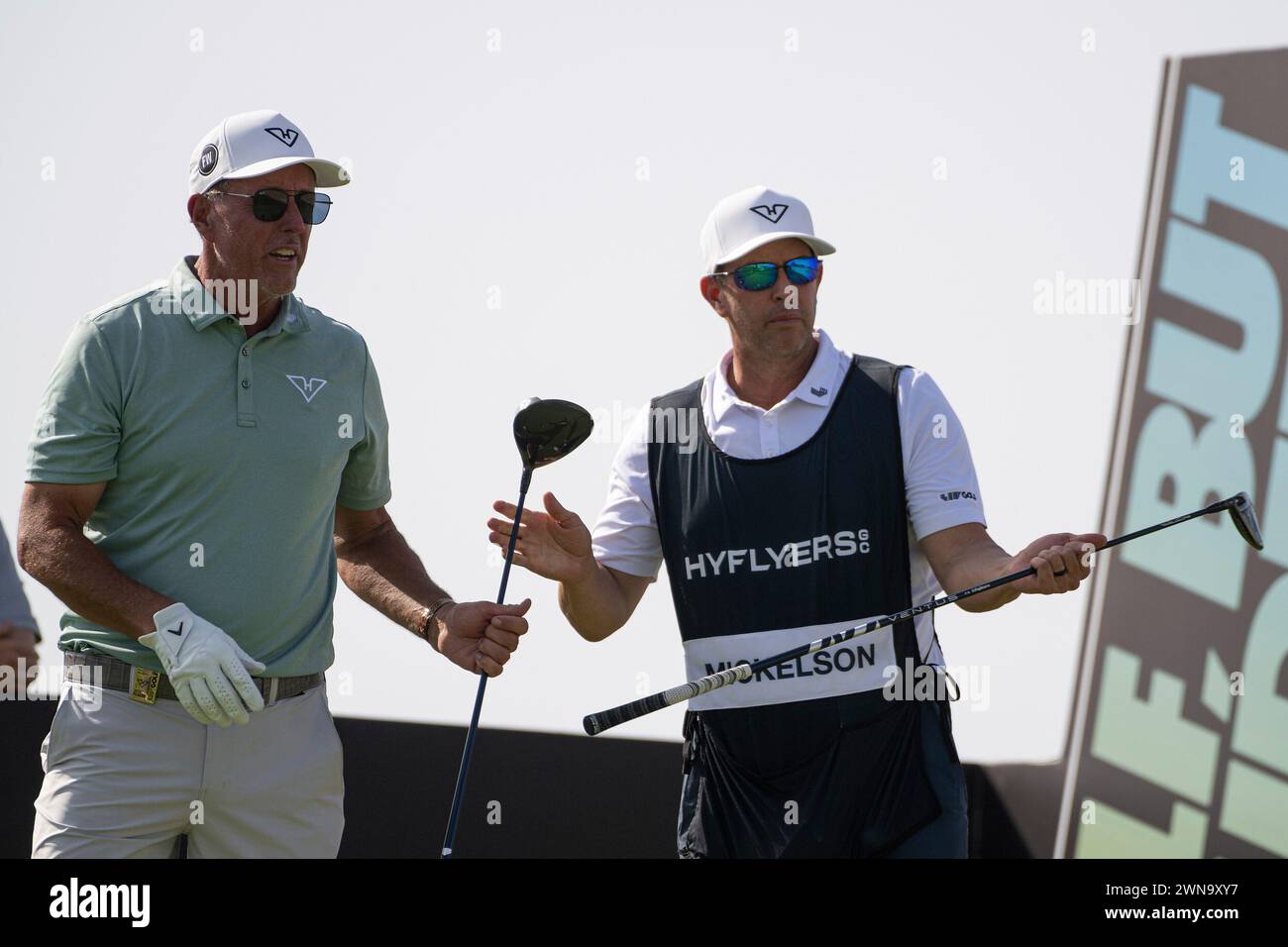 Captain Phil Mickelson of HyFlyers GC switches clubs with caddie, Tim ...