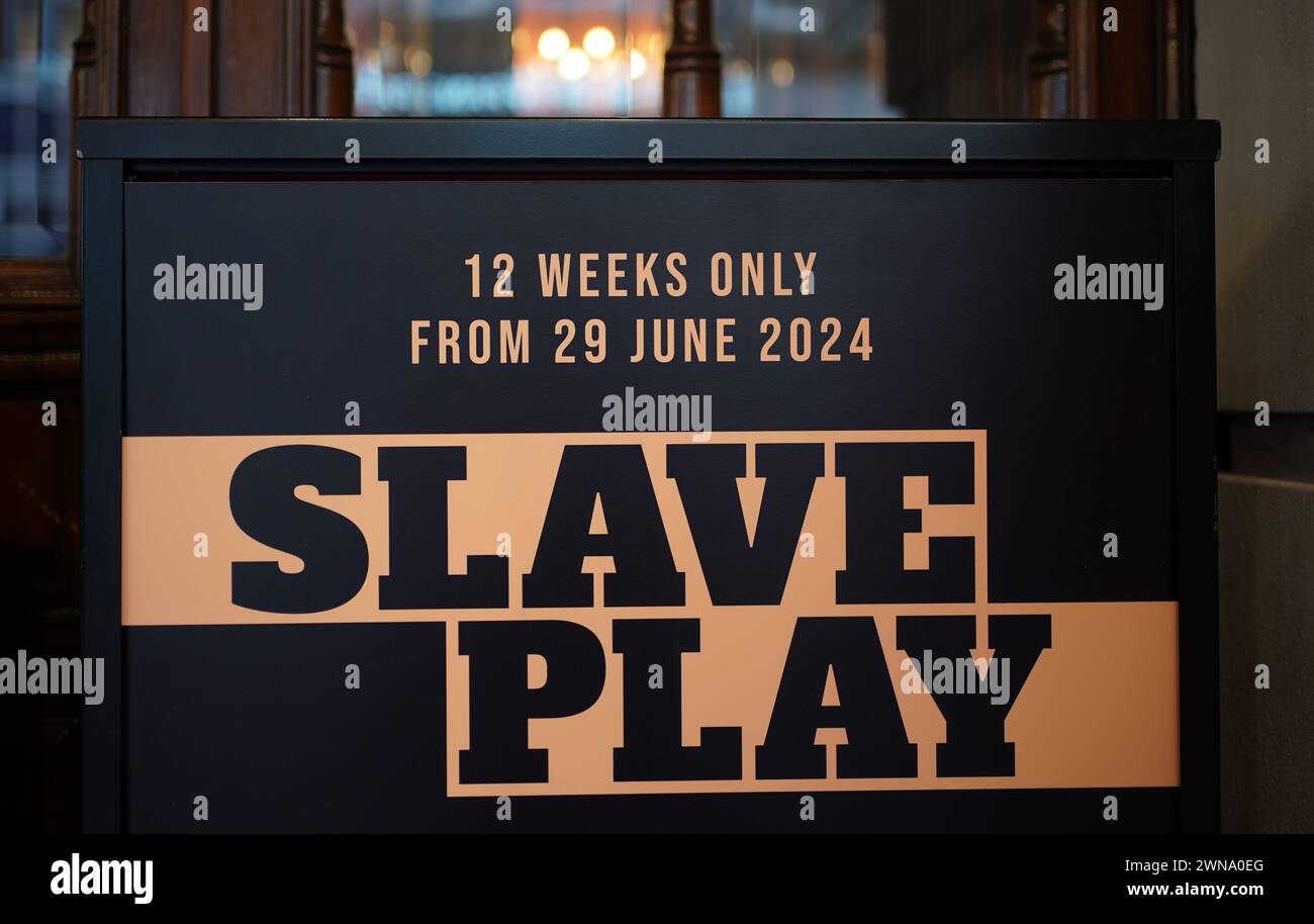 A poster for Slave Play at the Noel Coward Theatre in central London ...