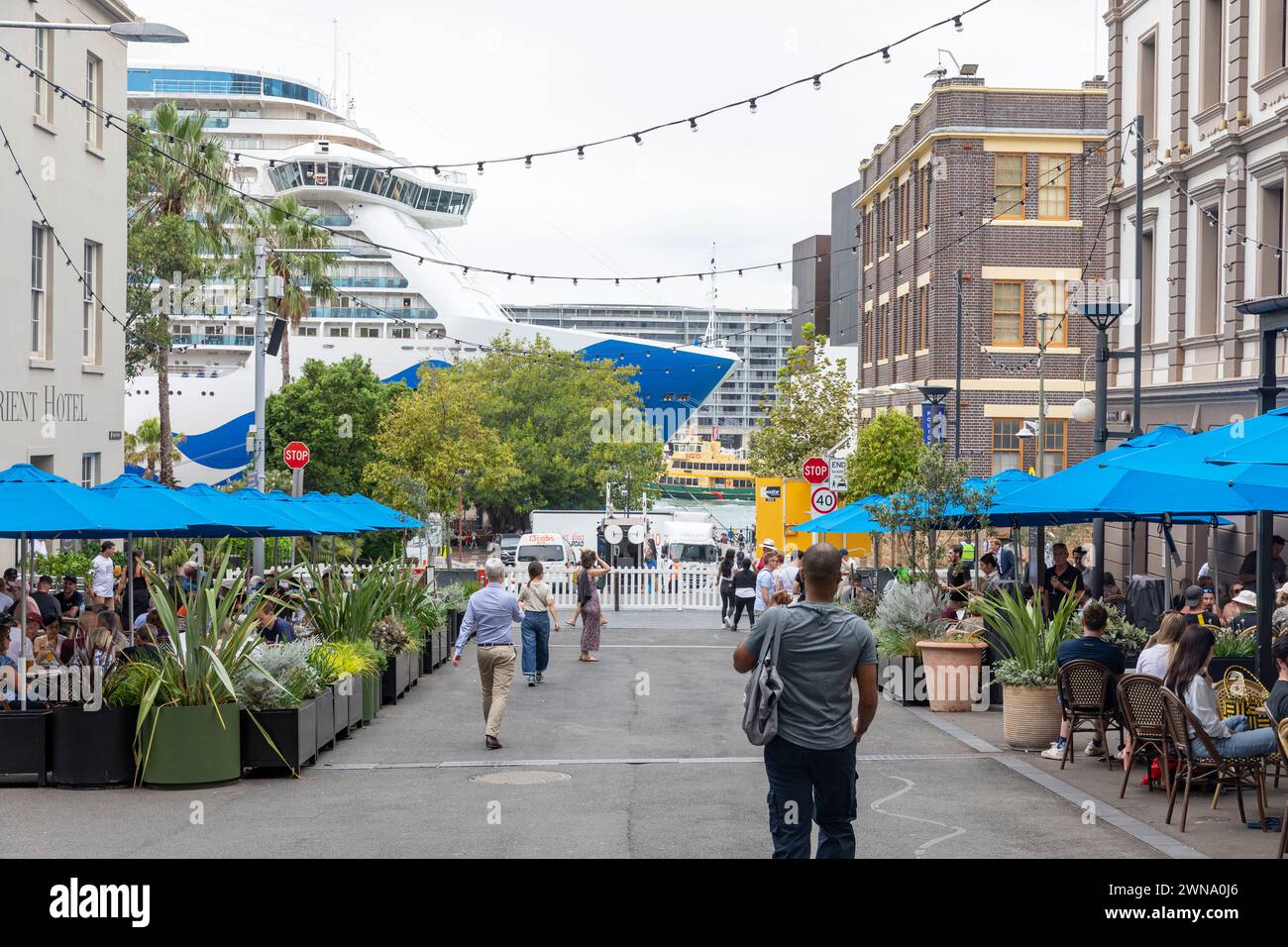 Sydney The rocks colonial area, tourists enjoy cafes and bars, cruise ...