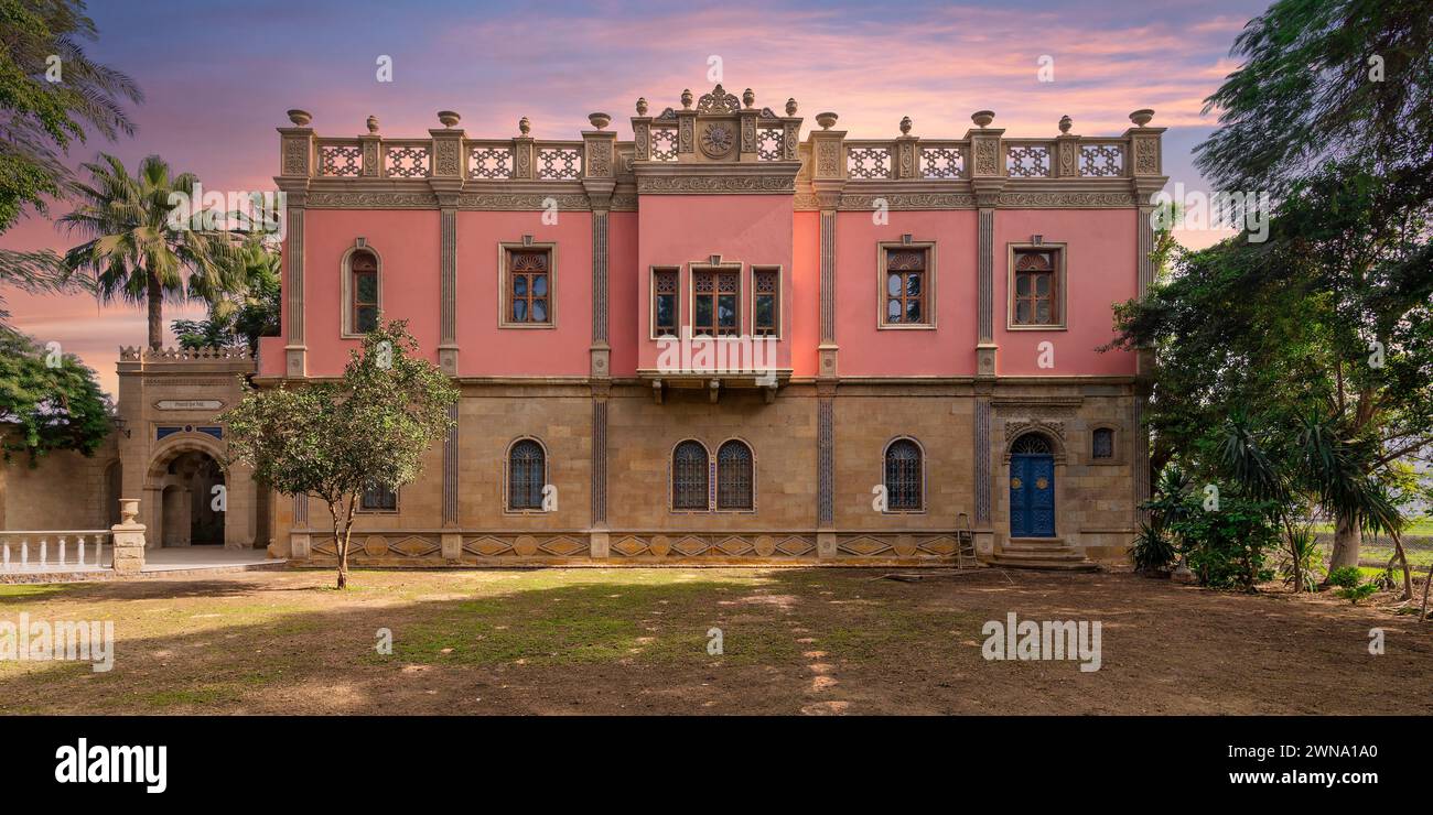 The warm sunset light bathes Prince Naguib Palace in a soft glow ...