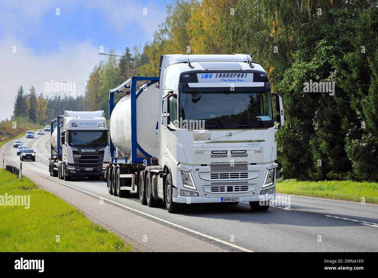 White Volvo FH and Scania trucks of LWG Transport Oy hauling Bruhn ...