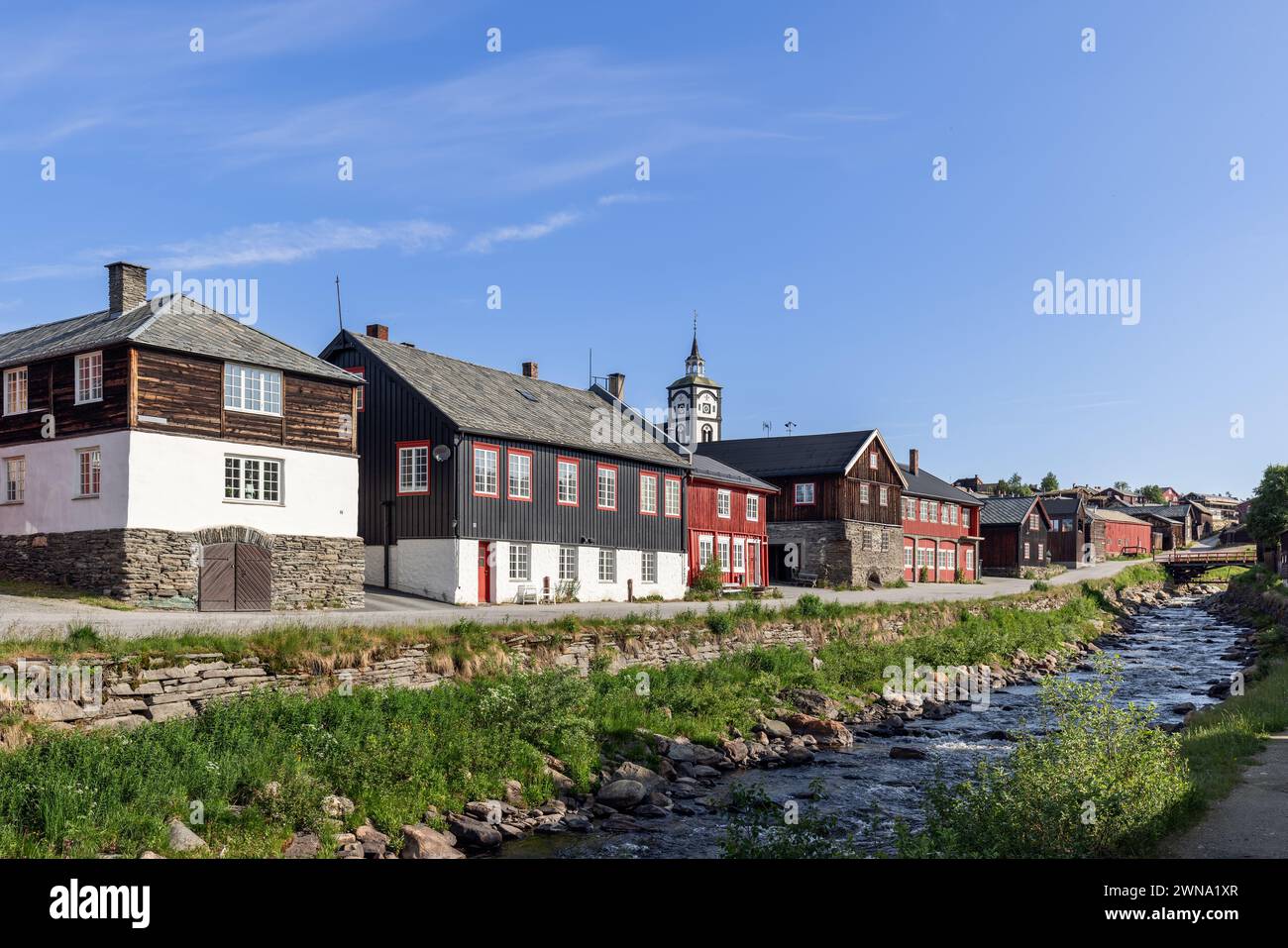 Roros presents a harmonious riverside setting where historic wooden ...