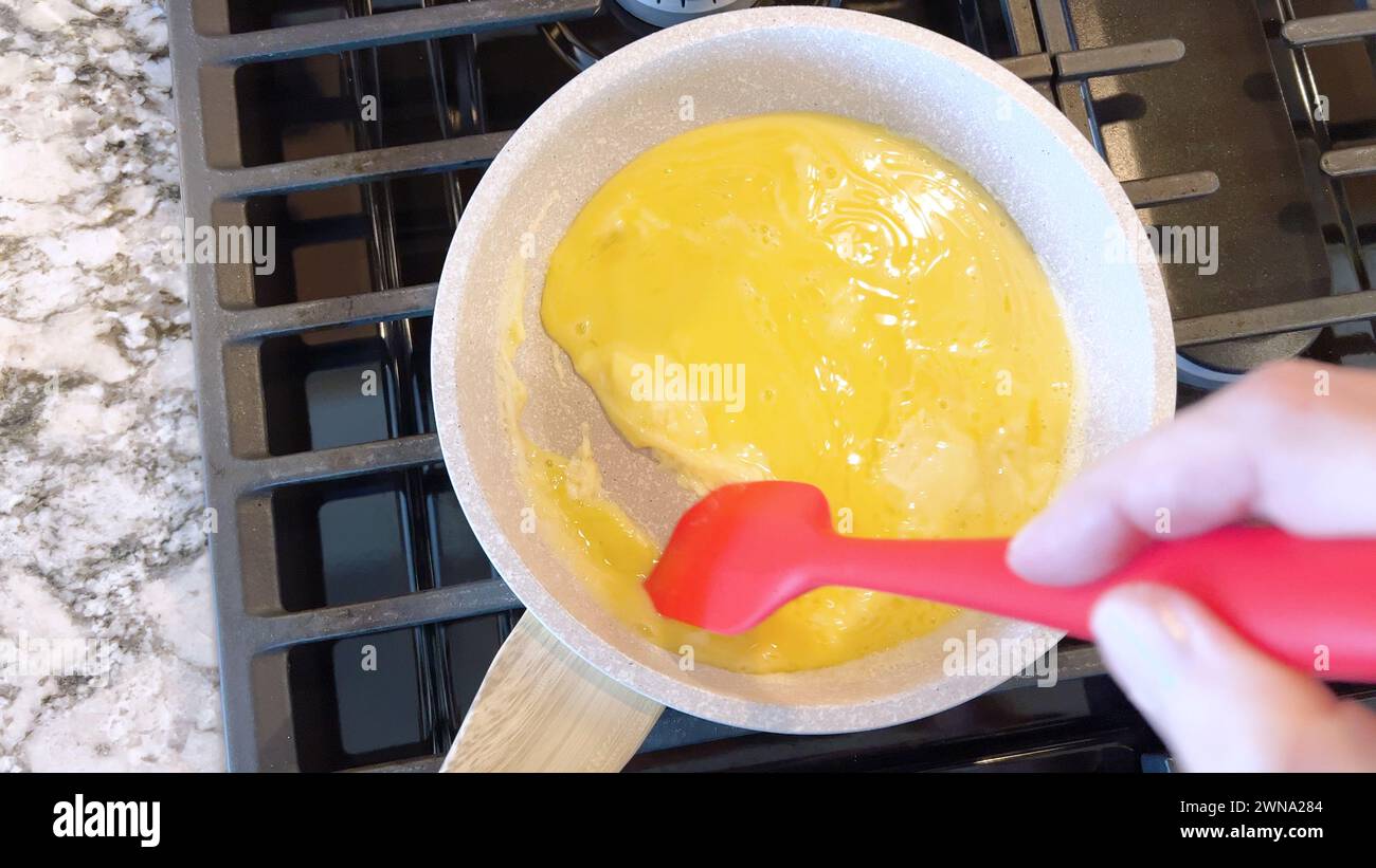 Frying eggs stovetop hi-res stock photography and images - Alamy