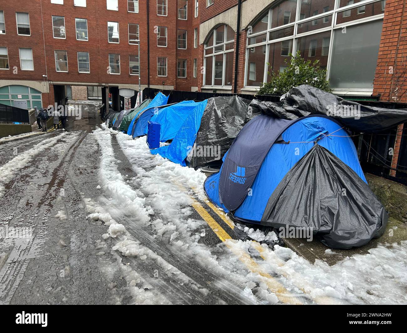 Tents, some flooded and collapsed, used by migrants and other people ...