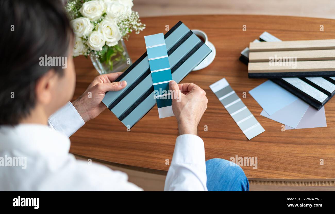 Acoustic panel. Interior architect holding wooden acoustic wall panel ...