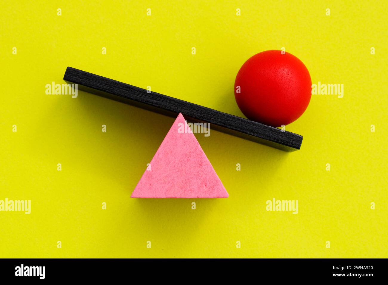 Sphere on swing breaking balance Stock Photo - Alamy