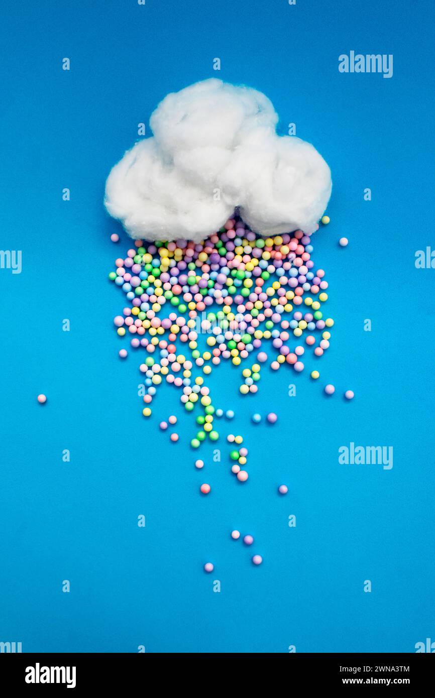 White cloud with rain of colorful spheres Stock Photo - Alamy