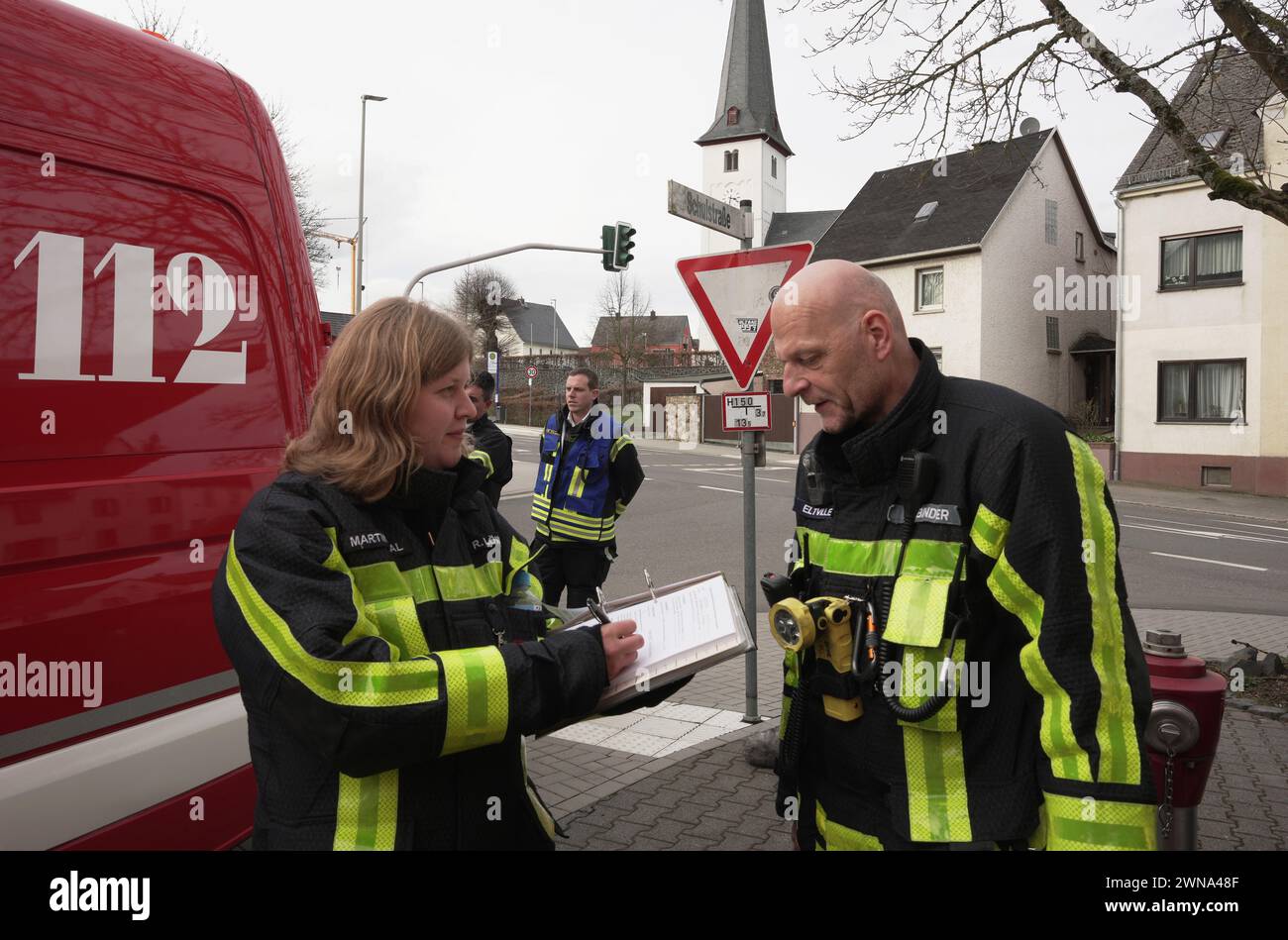Hadamar, Germany. 01st Mar, 2024. Firefighters inspect houses for a ...