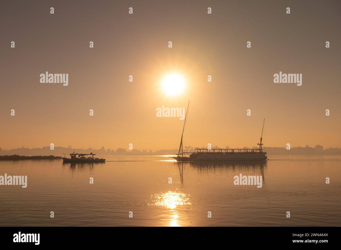 Silhouette of a traditional egyptian dahabiya boat cruising on the Nile ...