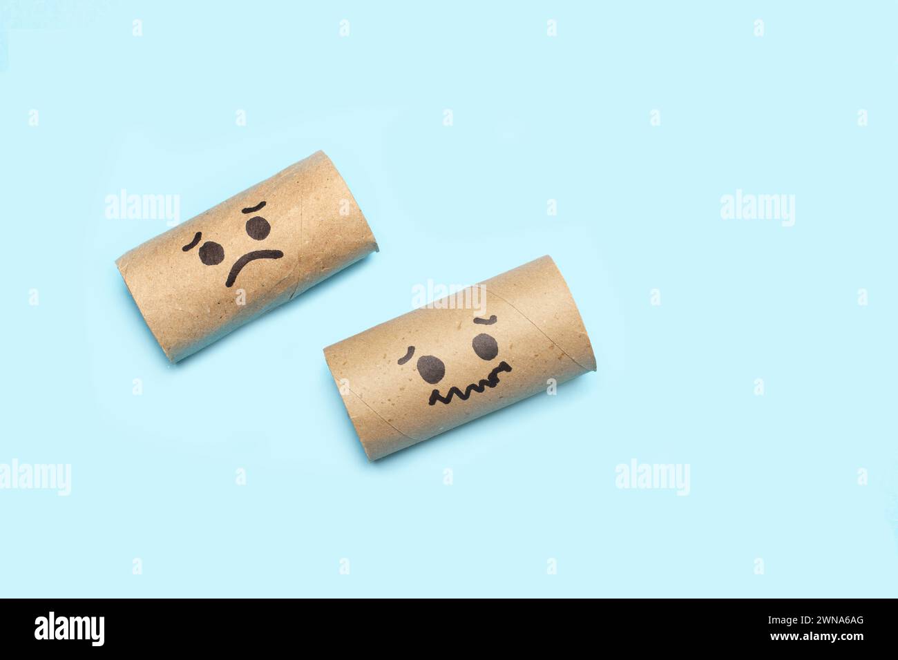 Cardboard center of a toilet paper rolls without paper with and sad ...