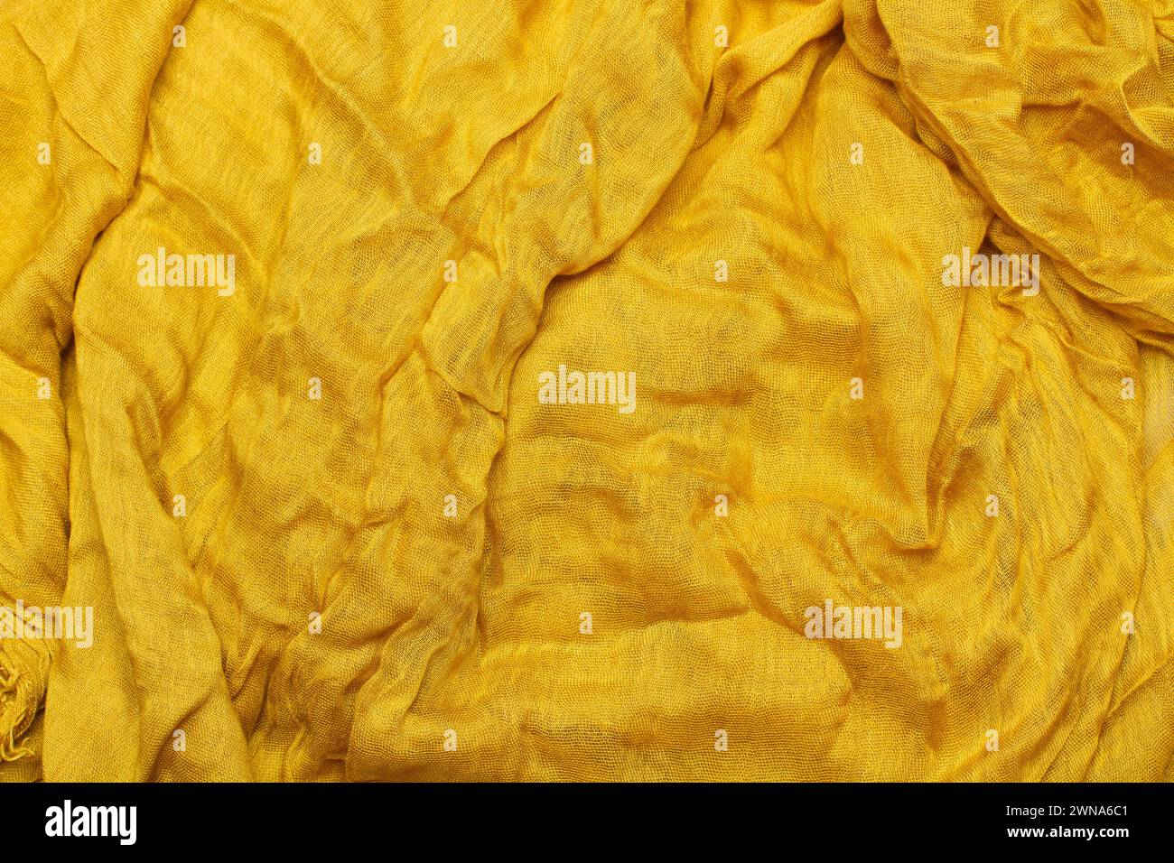 A yellow fabric texture in a close up view Stock Photo - Alamy