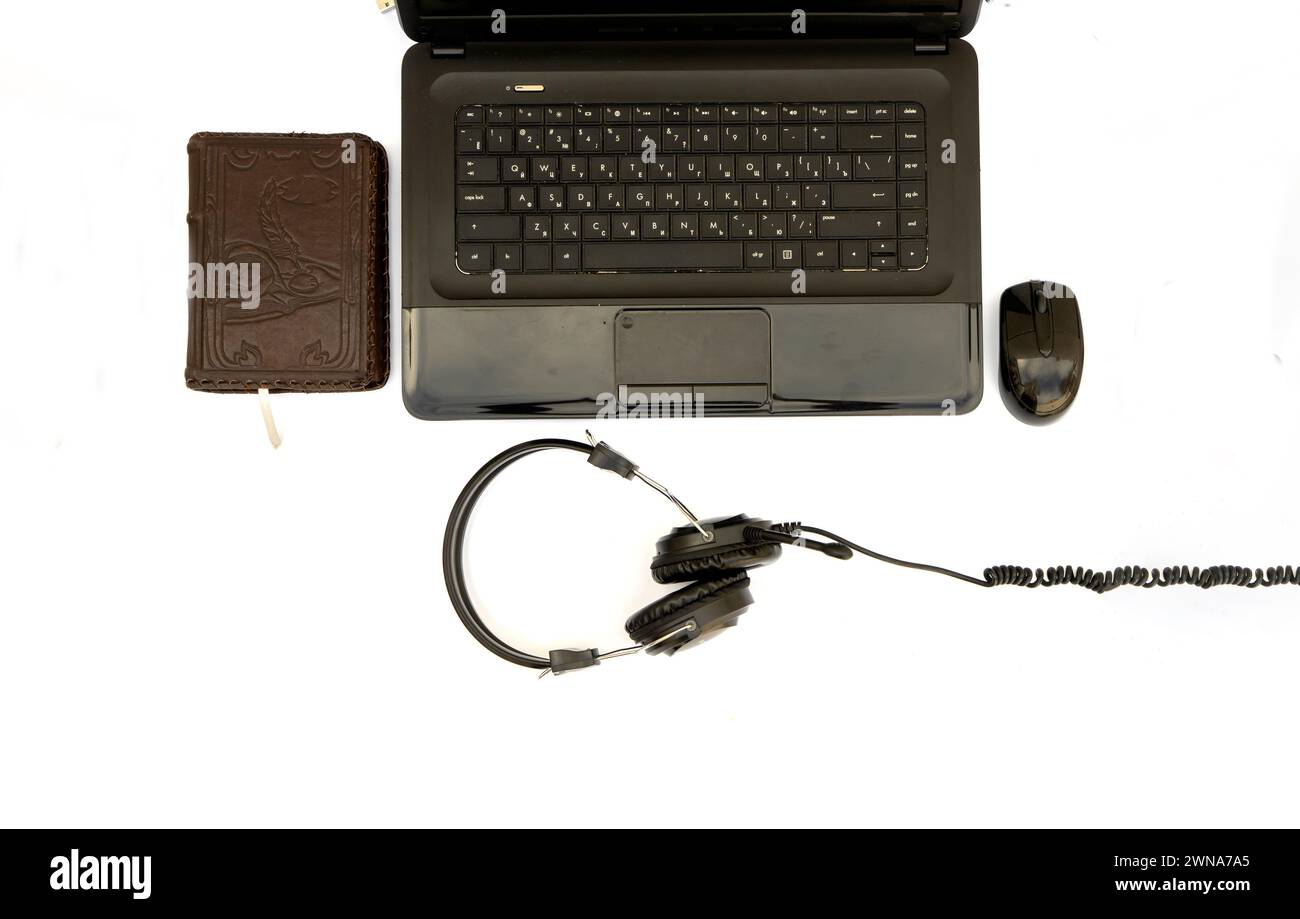 Modern workplace, accessories laptop, headphones, mouse, Notepad on a ...