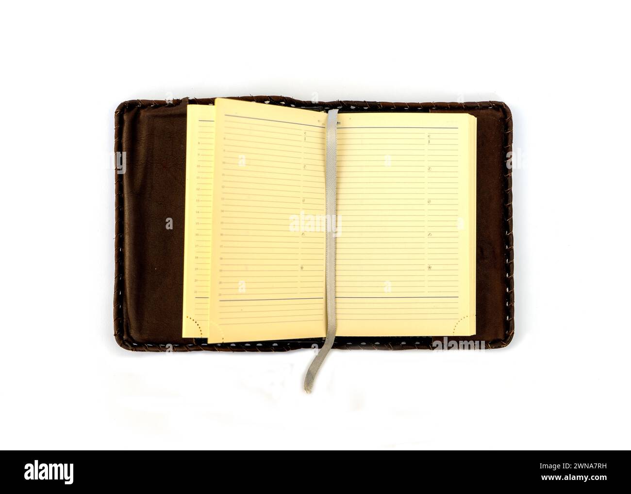 Open Notepad in dark brown genuine leather covers on a white background ...