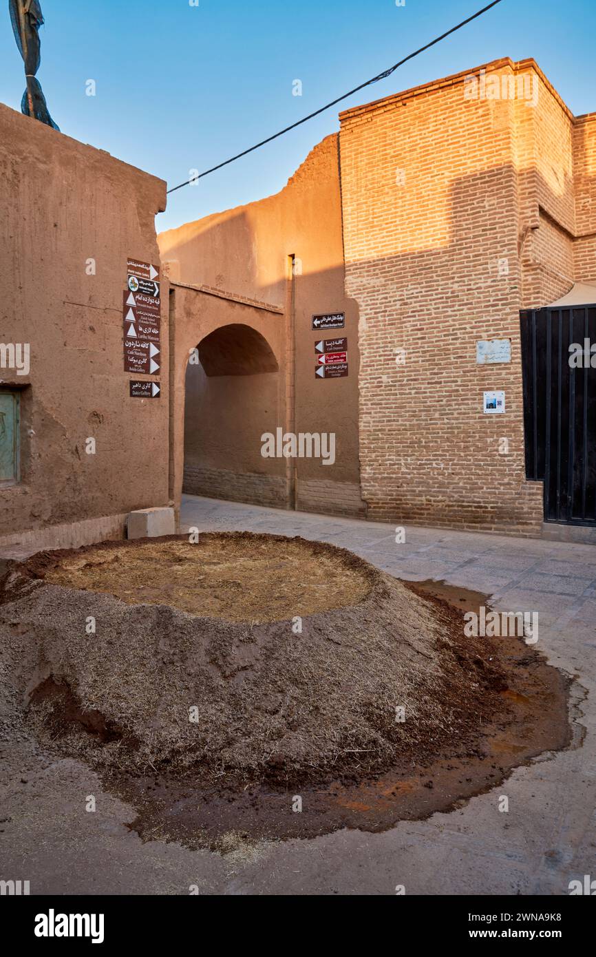 Raw adobe mixture (a composite of earth mixed with water, straw and ...