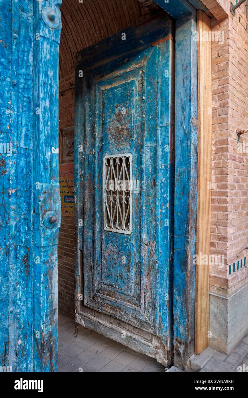 Close up view of an old blue wooden door in the historical center of ...