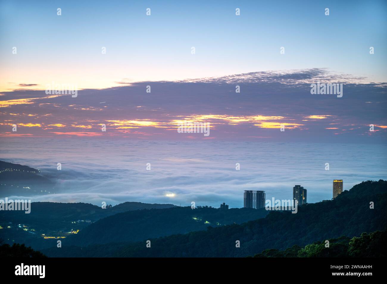 Clouds and mist drift over the city, and the colorful glaze light ...