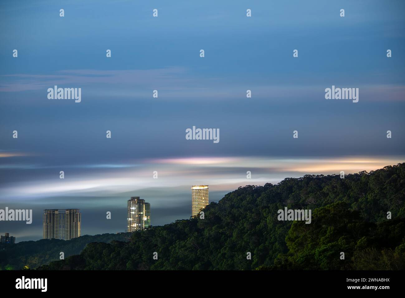 Clouds and mist drift over the city, and the colorful glaze light ...