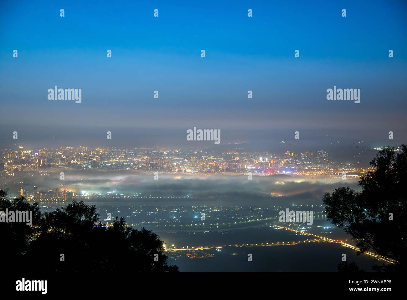 Clouds and mist drift over the city, and the colorful glaze light ...