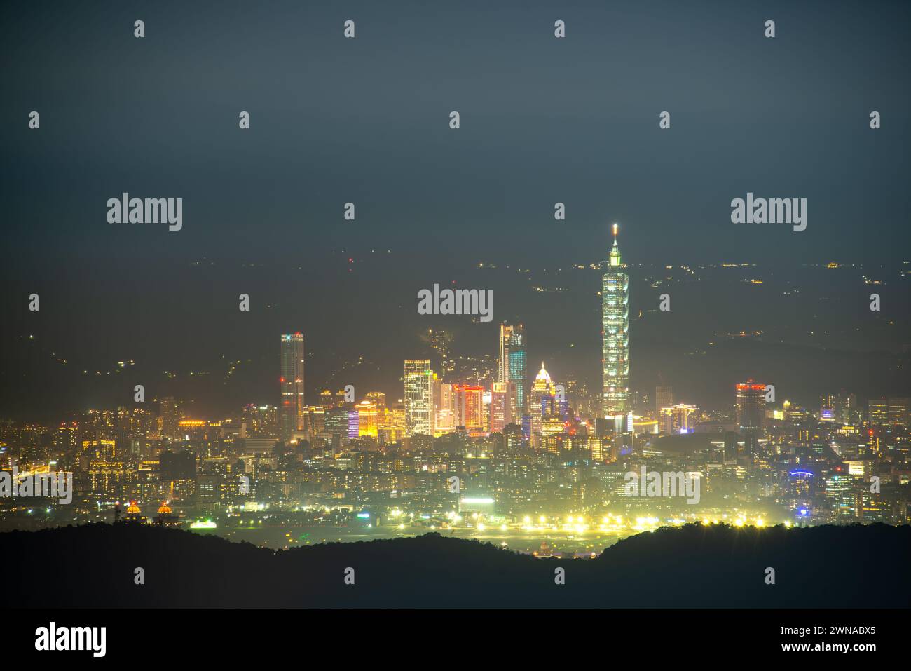 Clouds and mist drift over the city, and the colorful glaze light ...