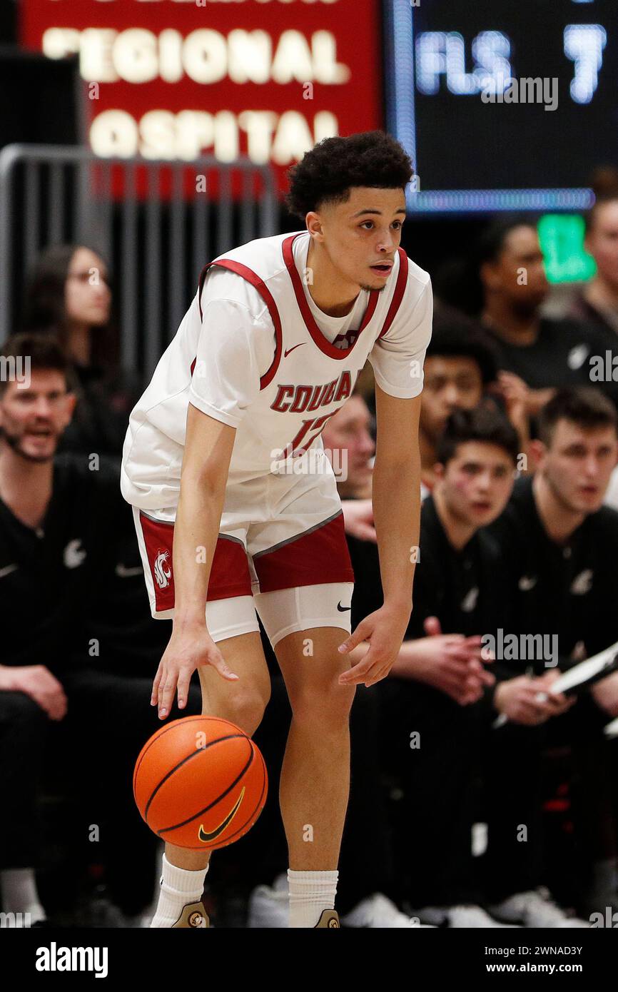 Washington State guard Isaiah Watts controls the ball during the second ...