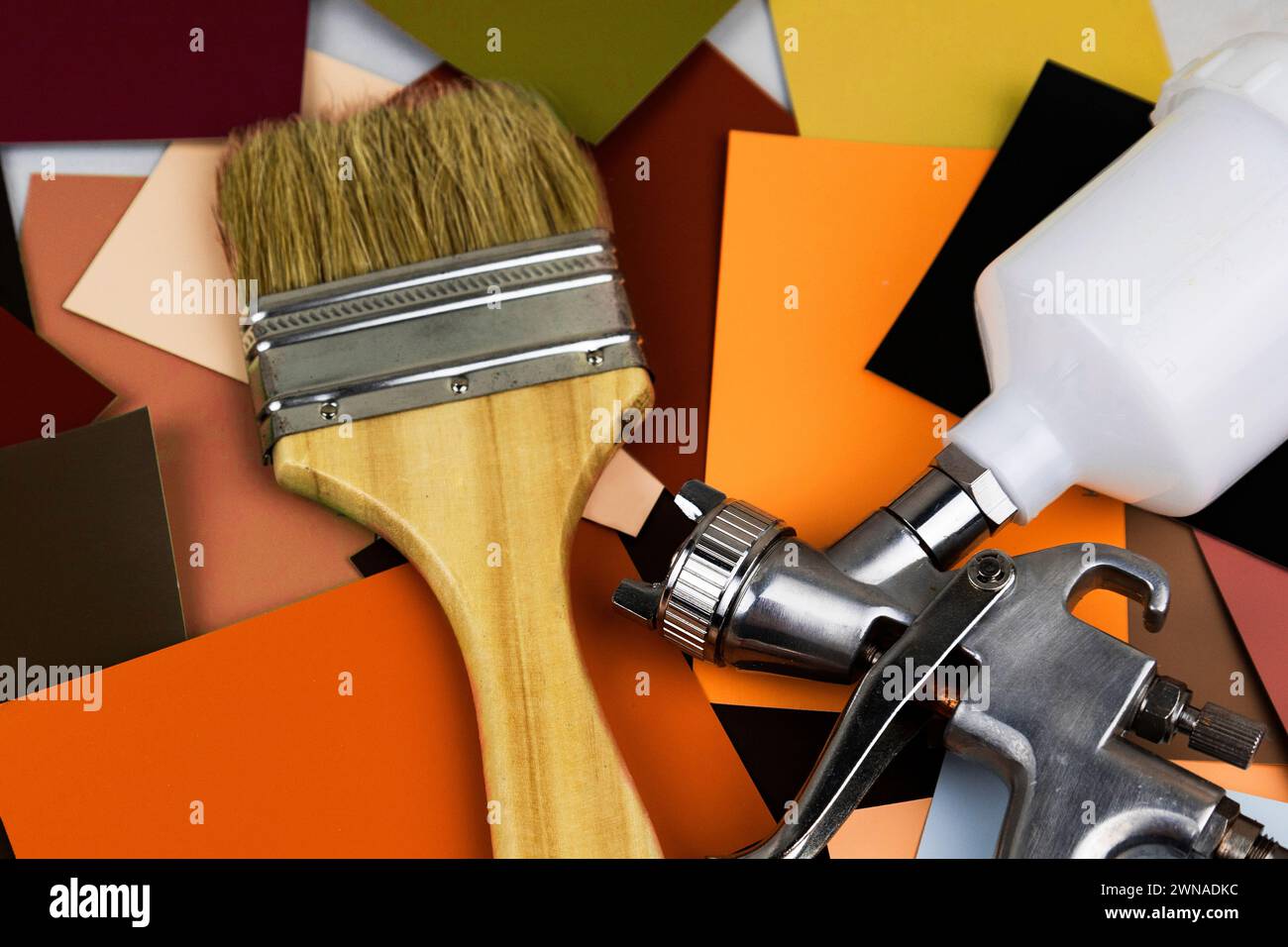 Paint spray gun at work at the workplace in the workshop. Paint Brush ...