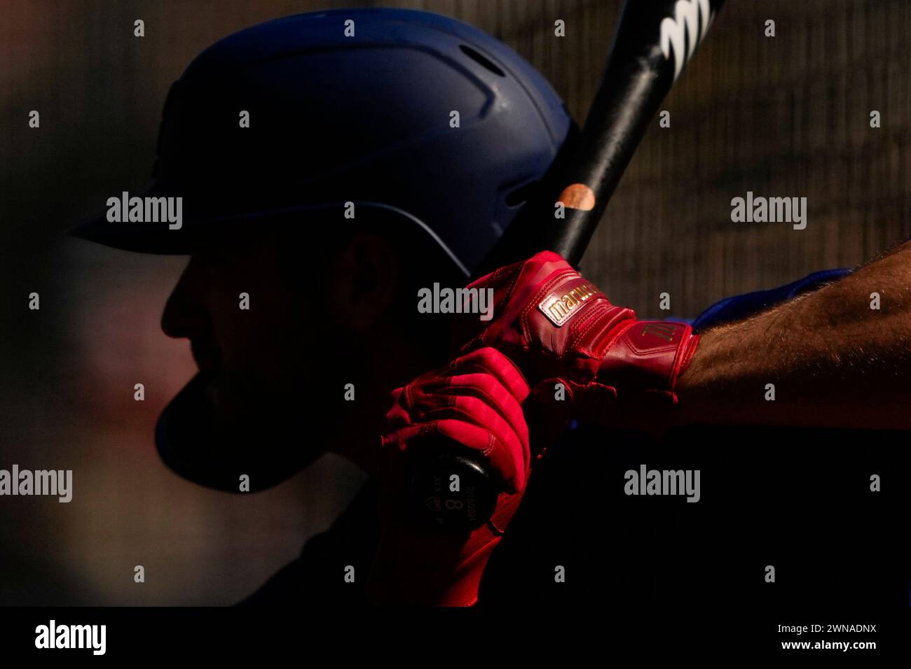 A Texas Rangers batter prepares on-deck during a spring training ...