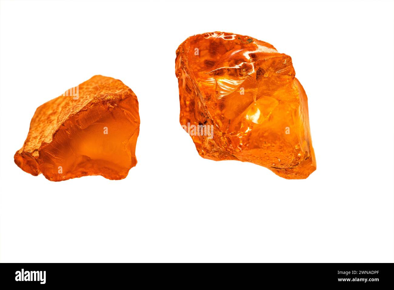 Yellow and orange raw amber pieces of different shapes. Raw materials ...