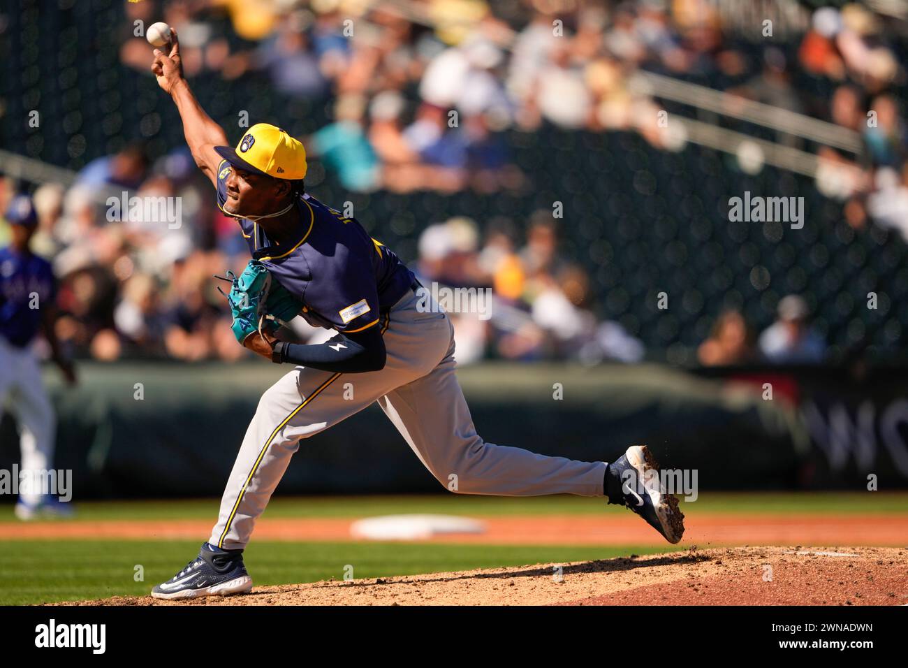 Milwaukee Brewers relief pitcher Abner Uribe throws during a spring ...