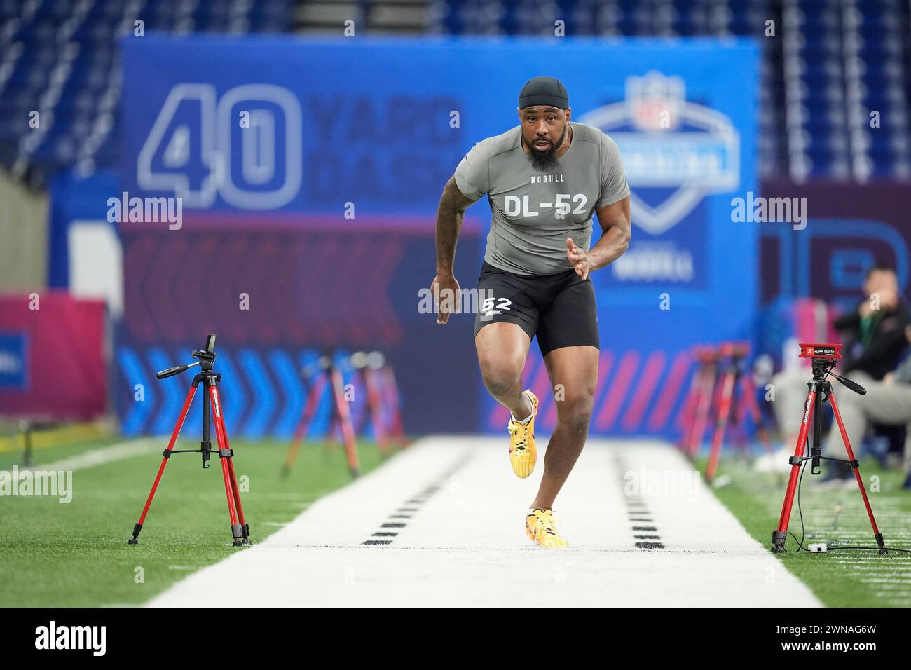 Connecticut defensive lineman Eric Watts runs the 40-yard dash at the ...