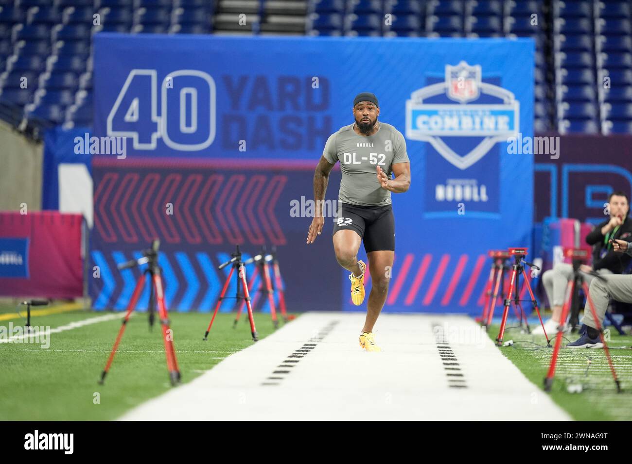Connecticut defensive lineman Eric Watts runs the 40-yard dash at the ...