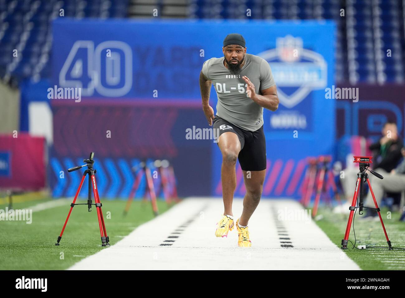 Connecticut defensive lineman Eric Watts runs the 40-yard dash at the ...