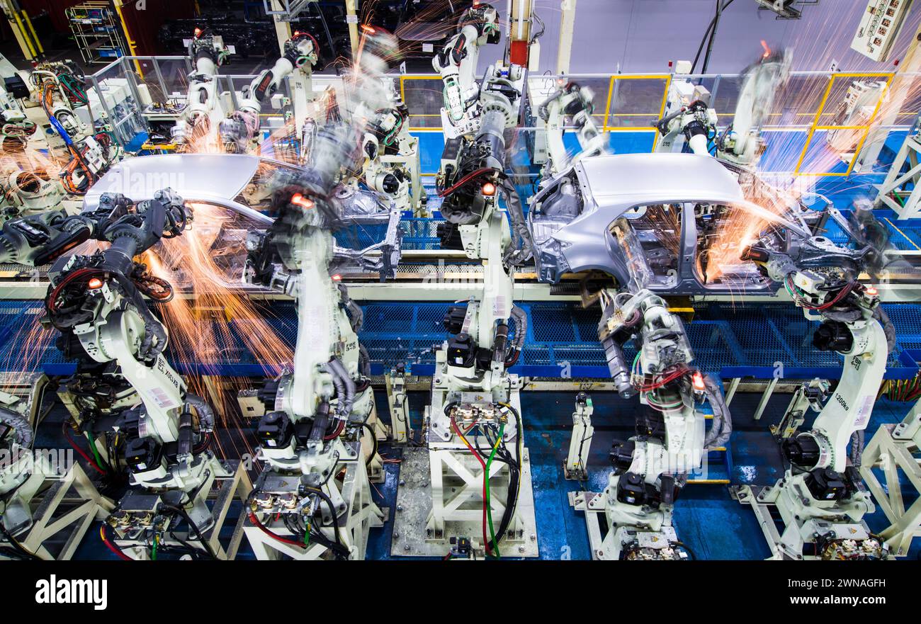 Sparks fly as robots weld Toyota Corolla bodyshells at Toyota's ...